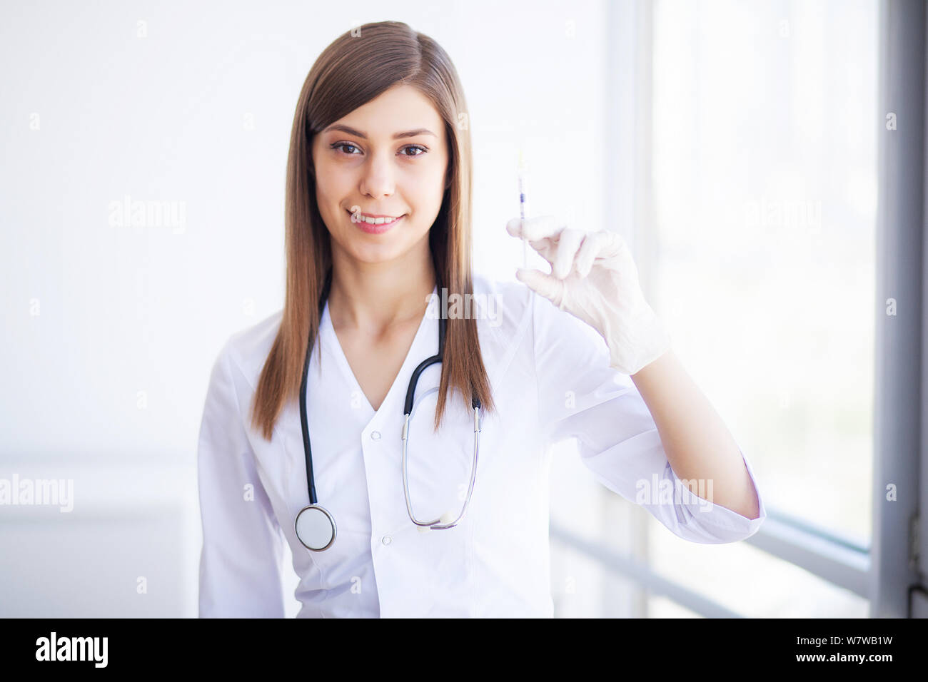 Health concept. Young female doctor on modern clinic background Stock ...