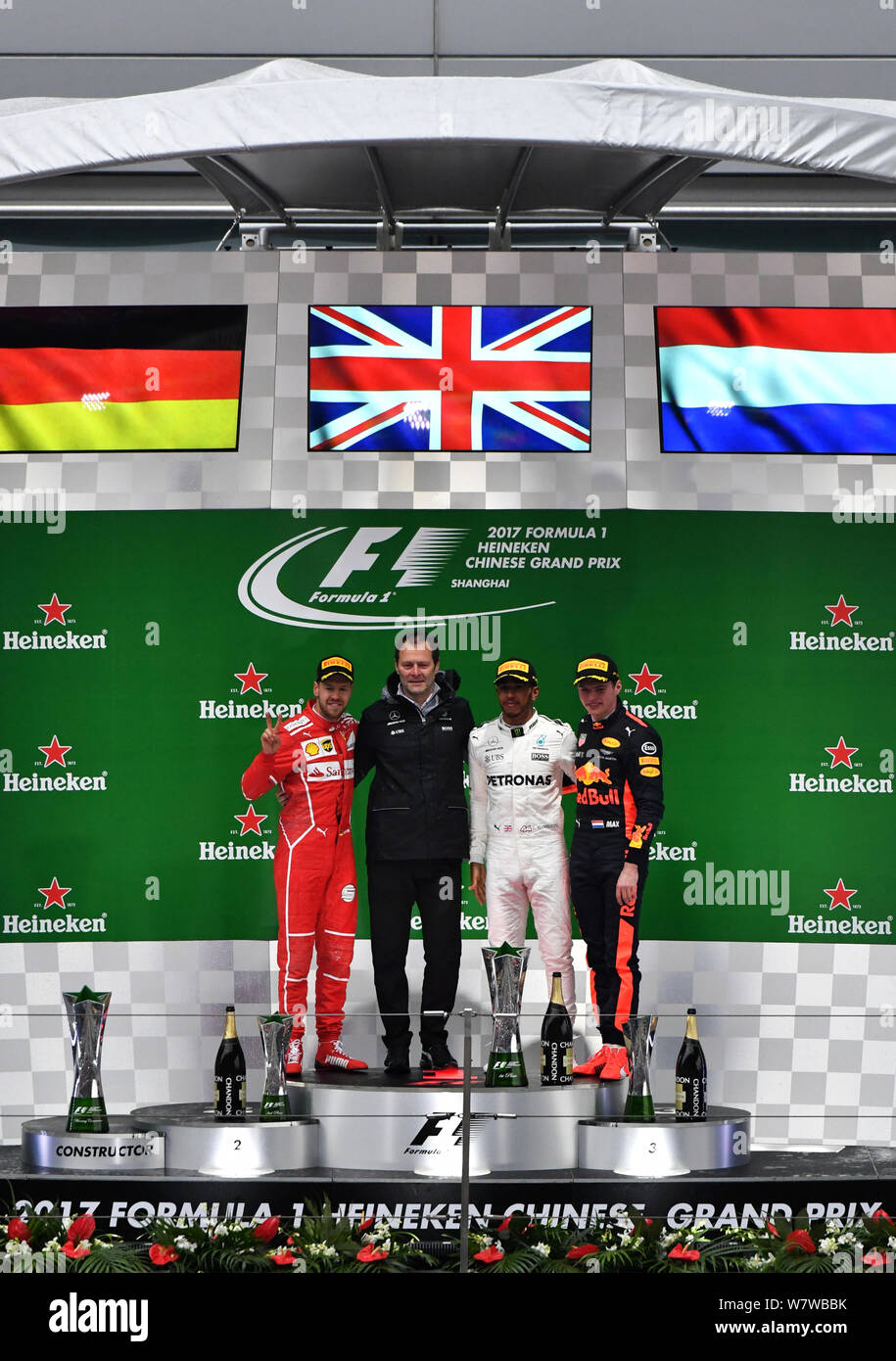 German F1 Sebastian Vettel of Ferrari, left, British F1 driver Lewis ...