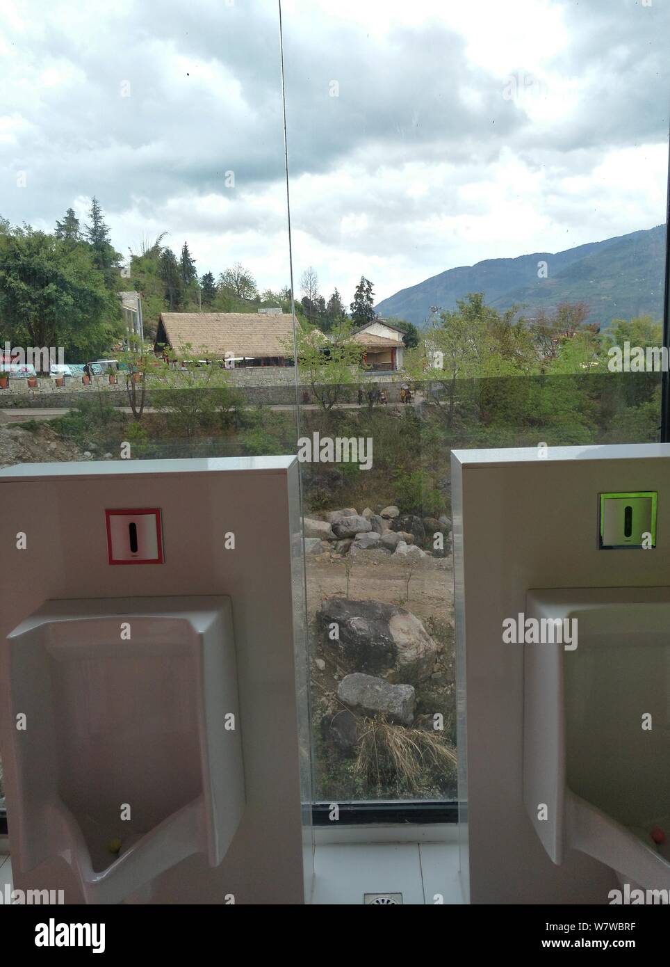 Interior view of a transparent toilet with glass walls to enable ...