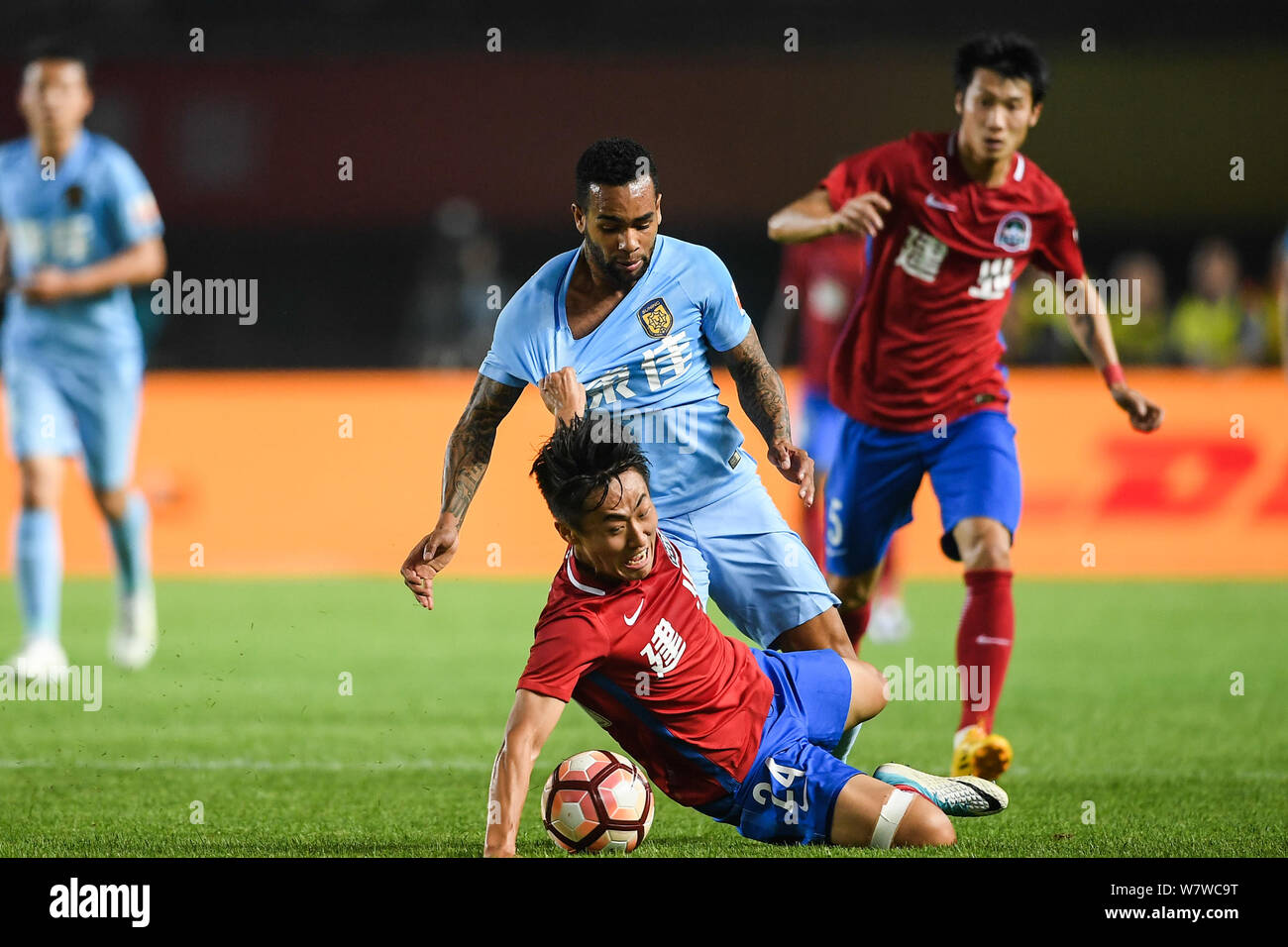 Brazilian football player Alex Teixeira of Jiangsu Suning, behind ...