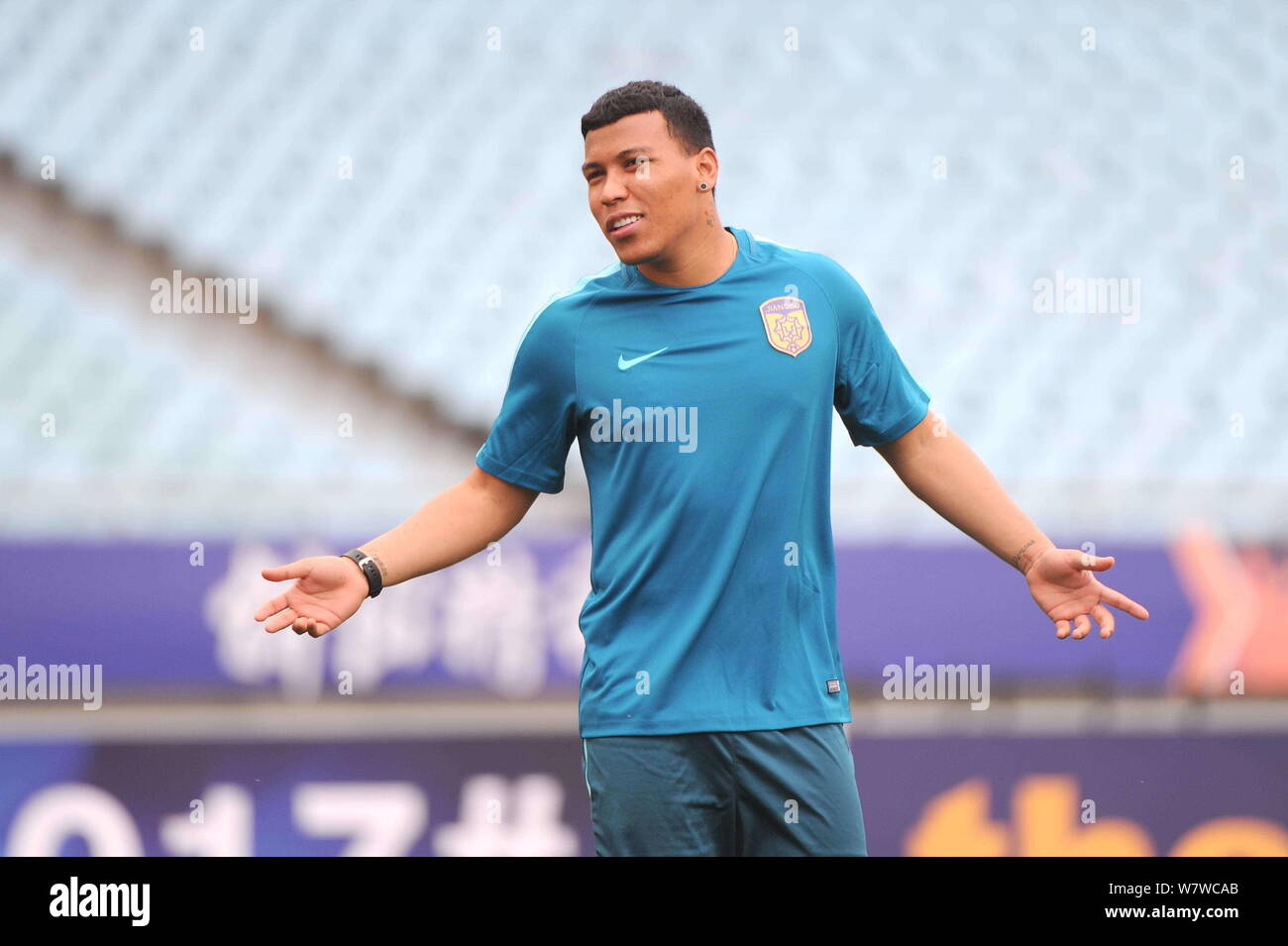 Colombian soccer player Roger Martinez of China's Jiangsu Suning takes ...