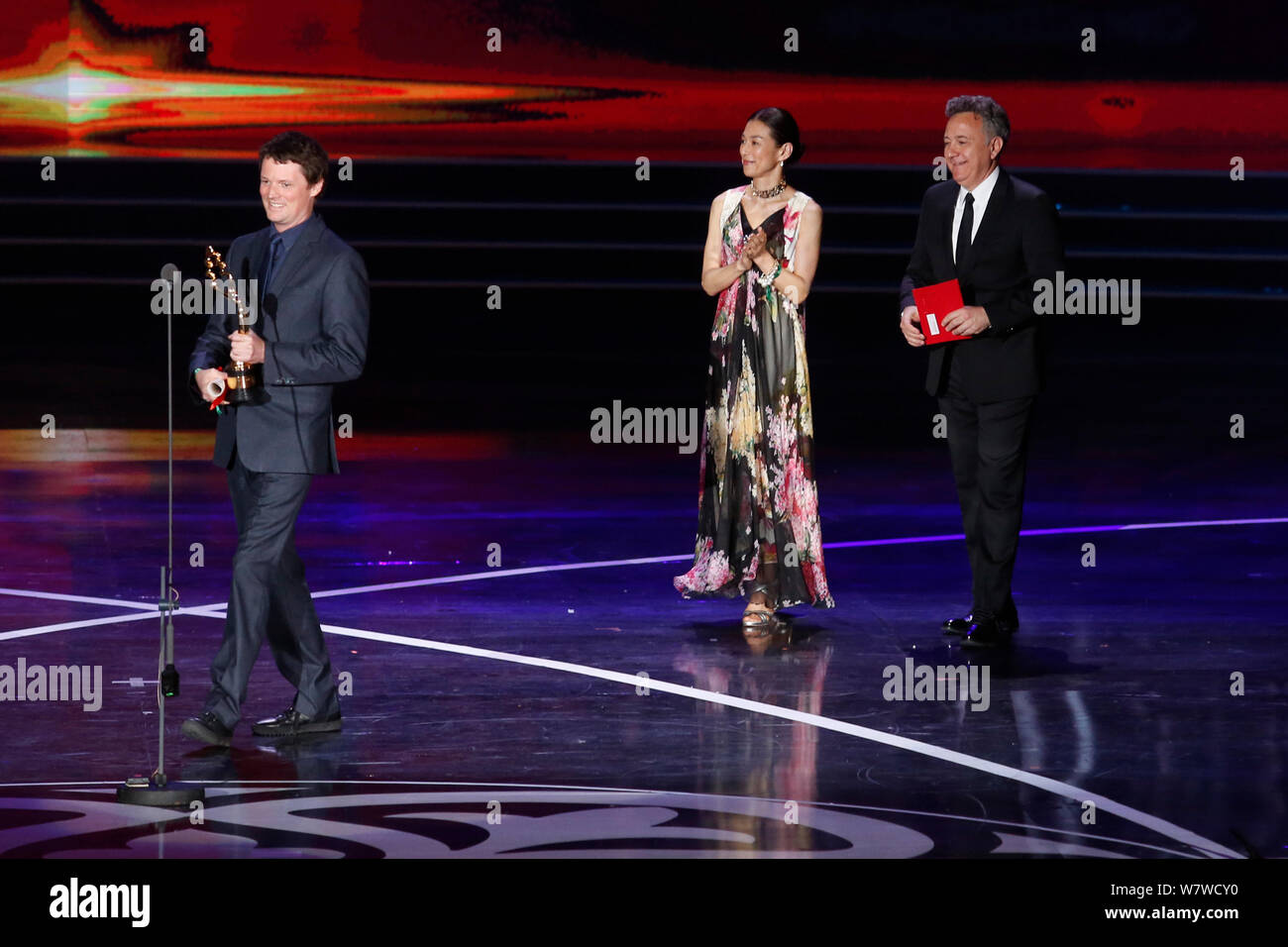 Director Cris Jones, left, poses with his trophy after winning the Best ...