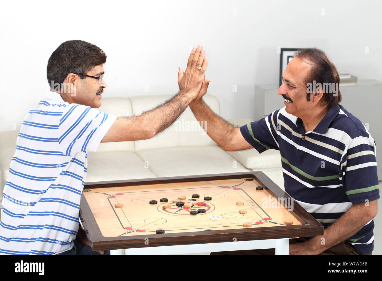 Carrom Board Man Playing Game High Resolution Stock Photography and ...