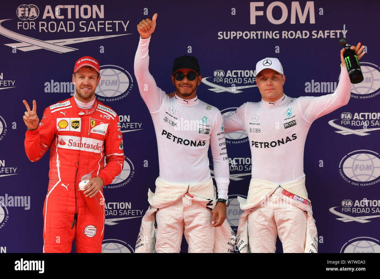 British F1 driver Lewis Hamilton of Mercedes, center, German F1 ...
