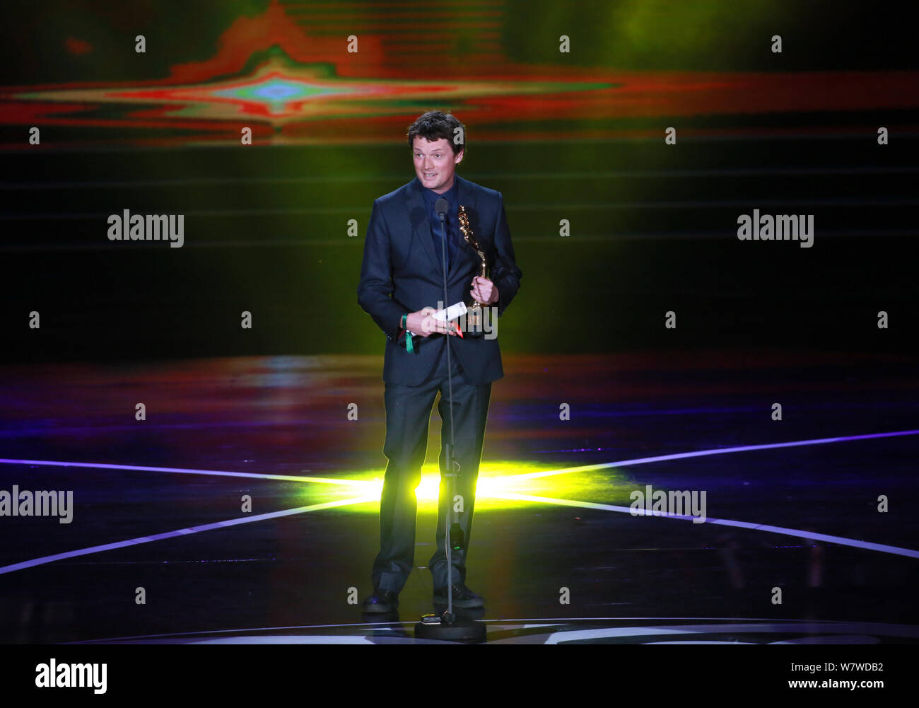 Director Cris Jones poses with his trophy after winning the Best Visual ...