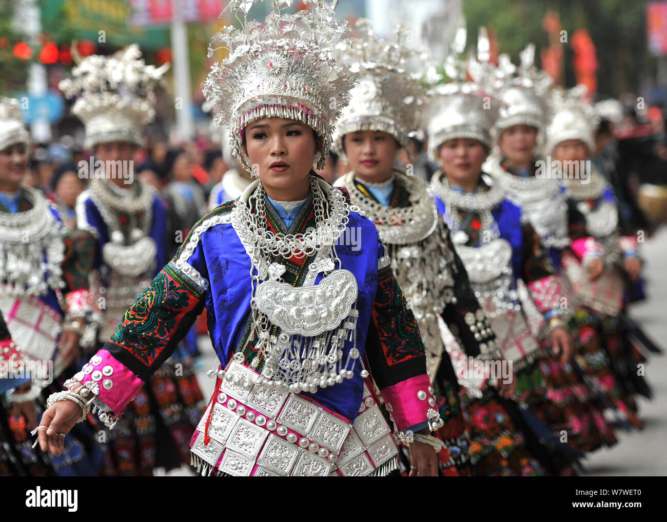 Chinese girls of Miao ethnic minority dressed in traditional silver ...