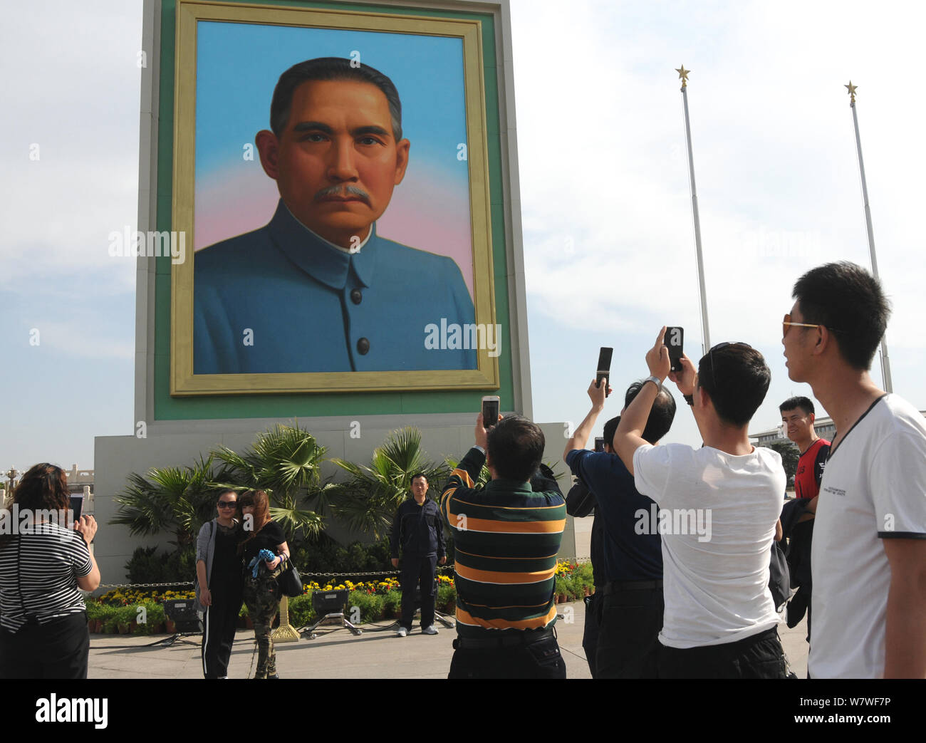 Visitors take photos of the huge portrait of Sun Yat-sen, first ...