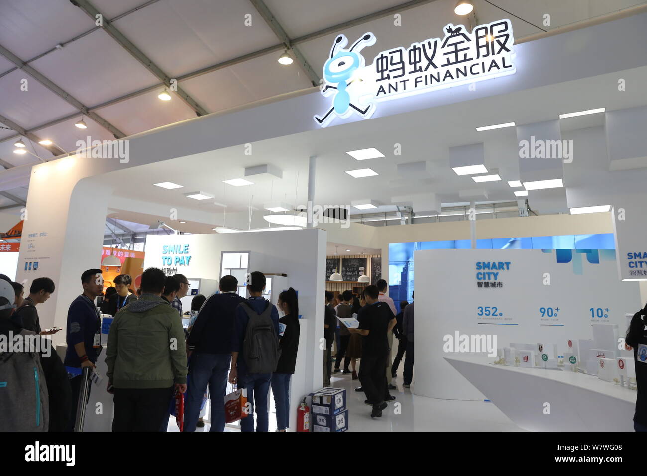--FILE--Visitors are seen at the stand of Ant Financial, the online ...