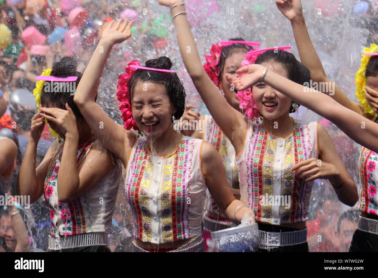 Local people and tourists sprinkle water to celebrate the Water ...