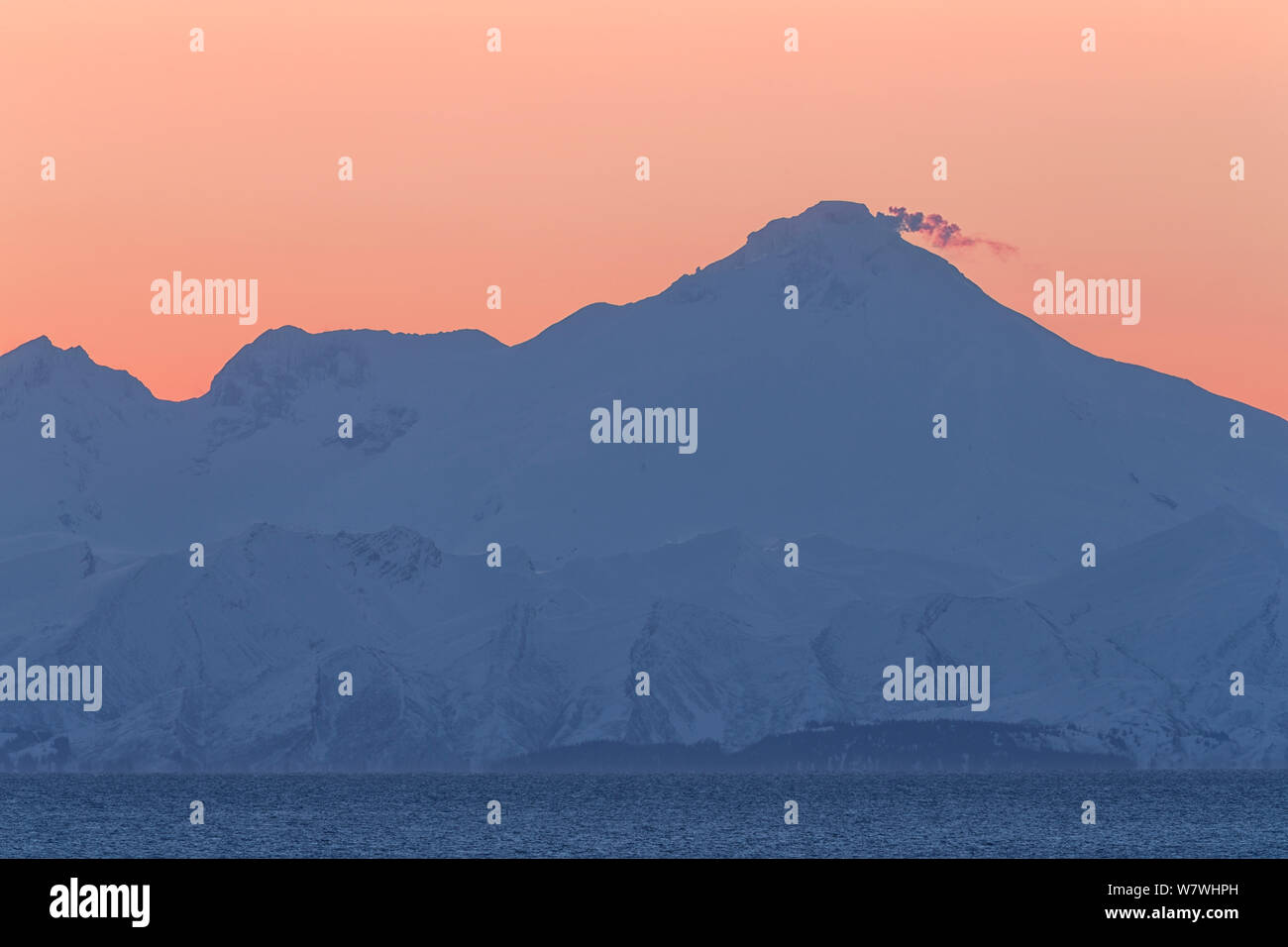 Mount Redoubt Volcano with steam coming out of crater at sunrise, Lake ...