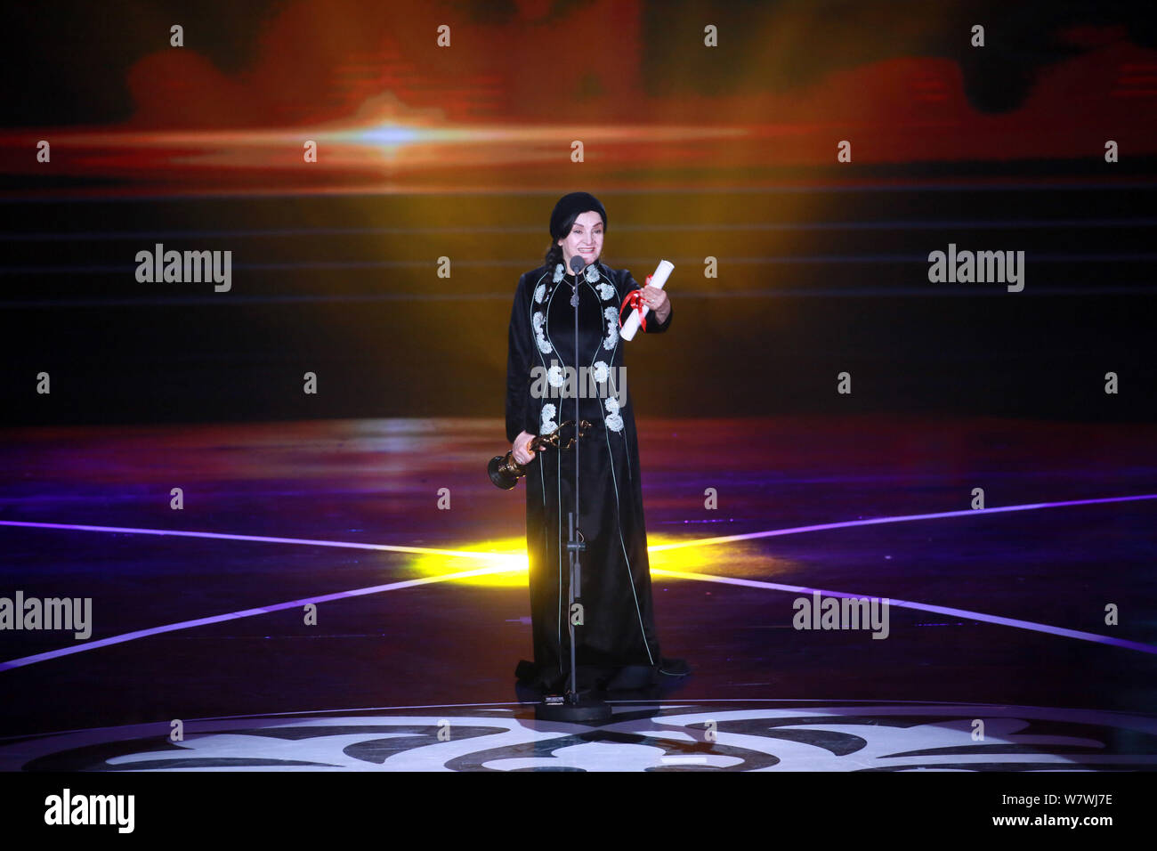 Iranian actress Golab Adineh poses with her trophy after winning the ...