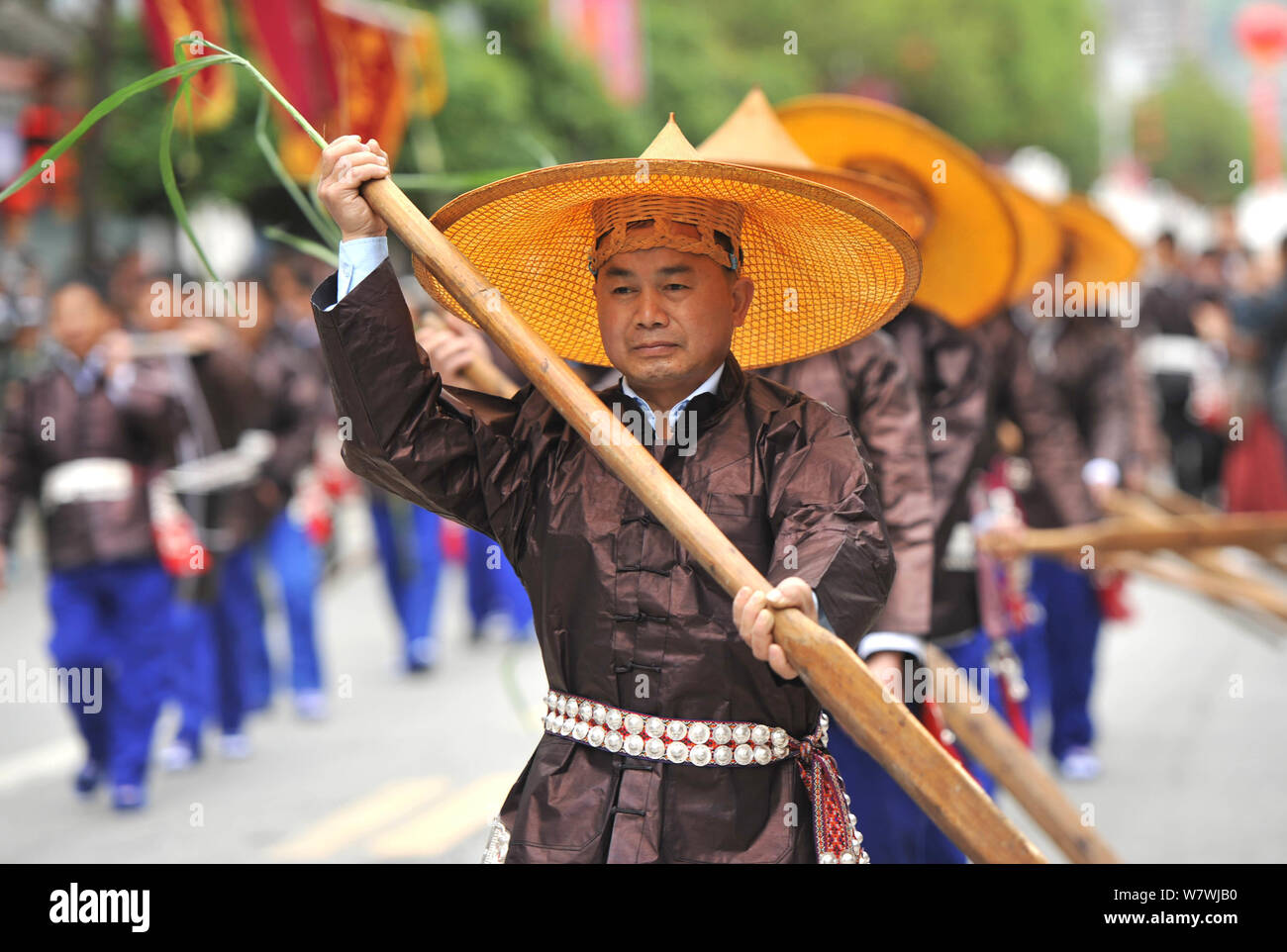 Chinese men of Miao ethnic minority wearing traditional costumes take ...