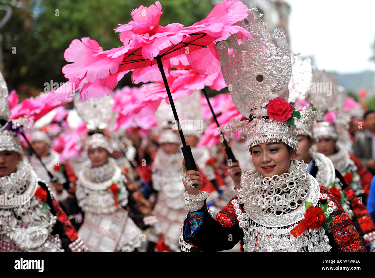 Chinese girls of Miao ethnic minority dressed in traditional silver ...