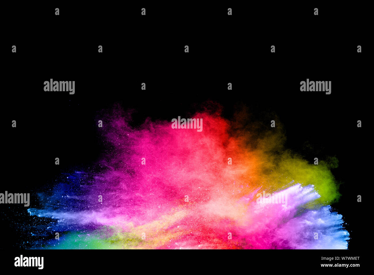 Launched colorful powder on black background.Color powder explosion ...