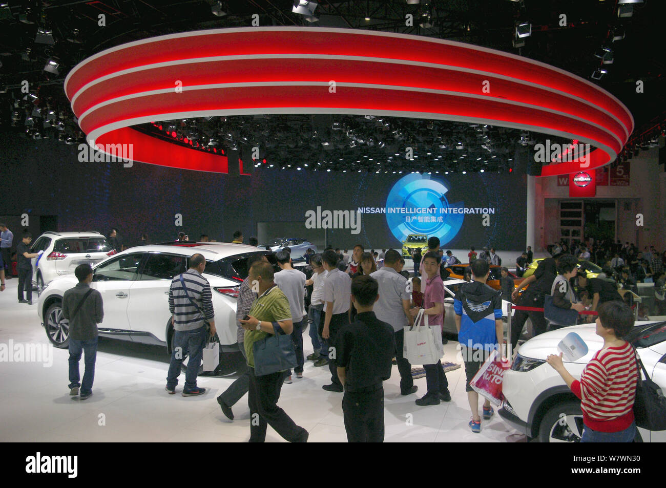 --FILE--People visit the stand of Nissan during the 14th Beijing ...