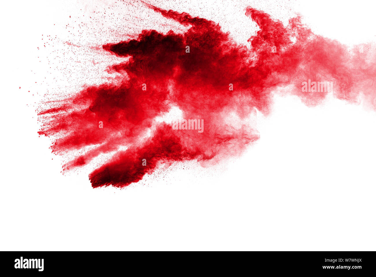 Abstract red dust splattered on white background. Red powder explosion ...