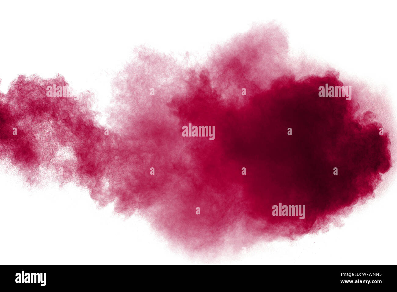 Abstract red dust splattered on white background. Red powder explosion ...
