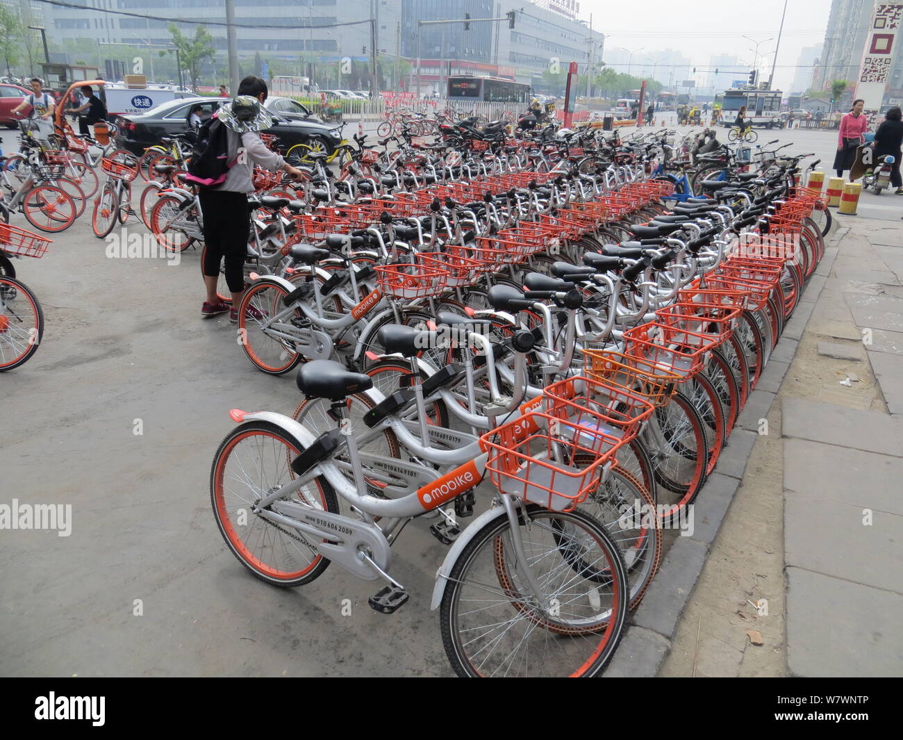 Bicycles of Chinese bike-sharing services Mobike are lined up at a ...