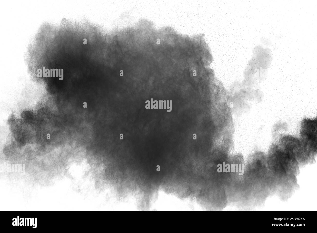 Black powder explosion against white background. Black dust particles ...