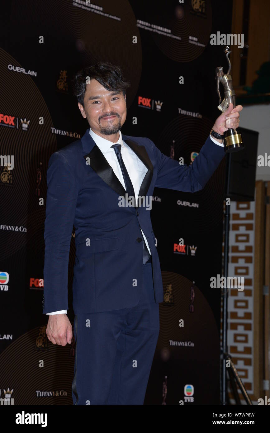 Hong Kong actor Gordon Lam poses with his trophy after winning the Best ...