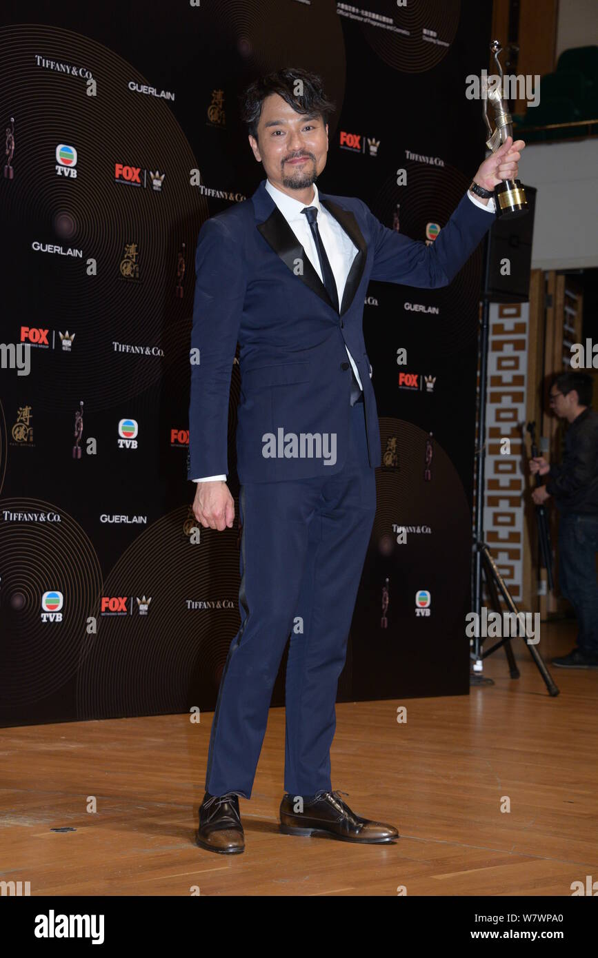 Hong Kong actor Gordon Lam poses with his trophy after winning the Best ...