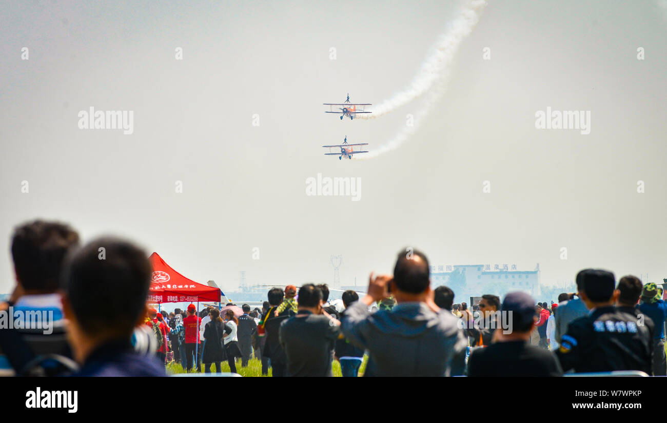 Locals watch British aerobatics and wingwalking team AeroSuperBatics ...