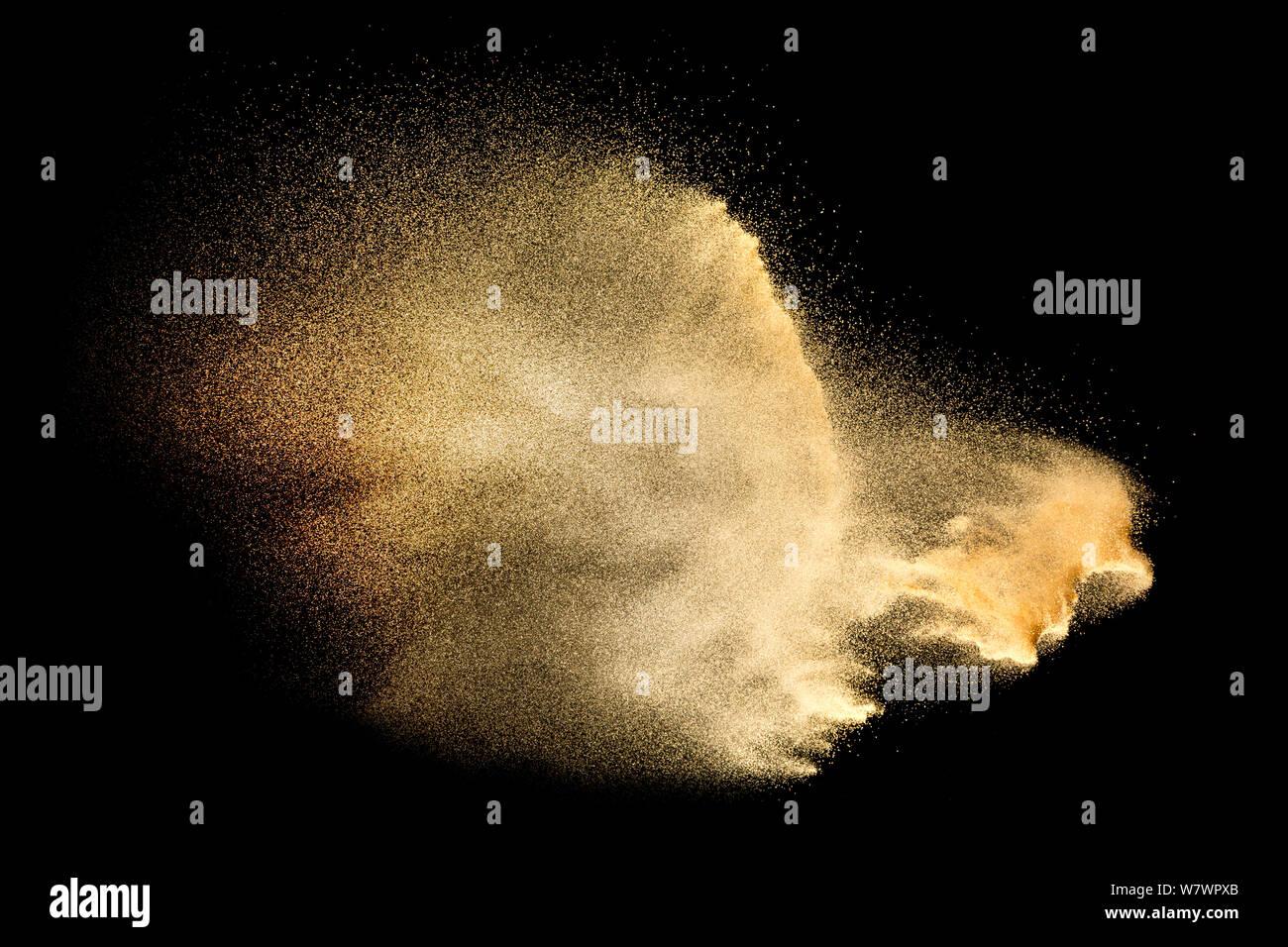 Sand explosion isolated on black background. Freeze motion of sandy ...