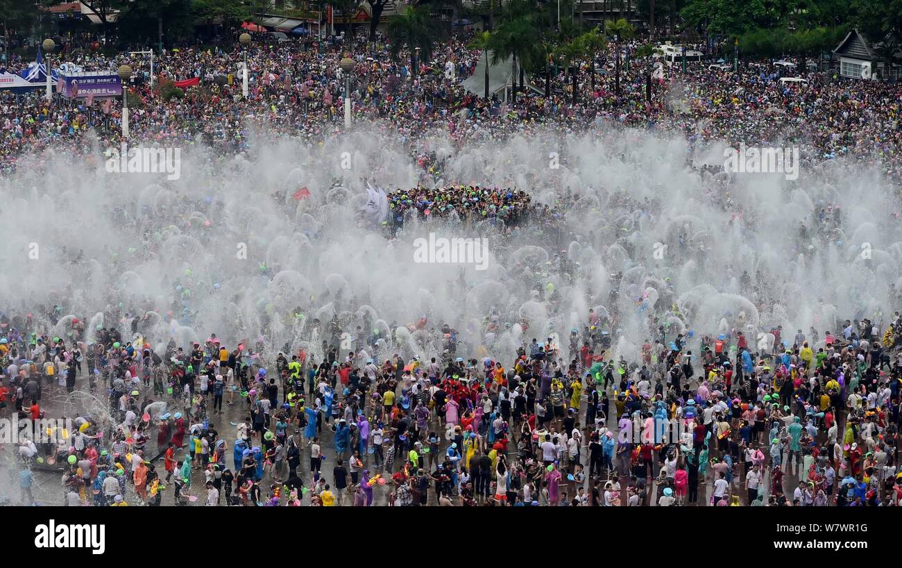Local people and tourists sprinkle water to celebrate the Water ...