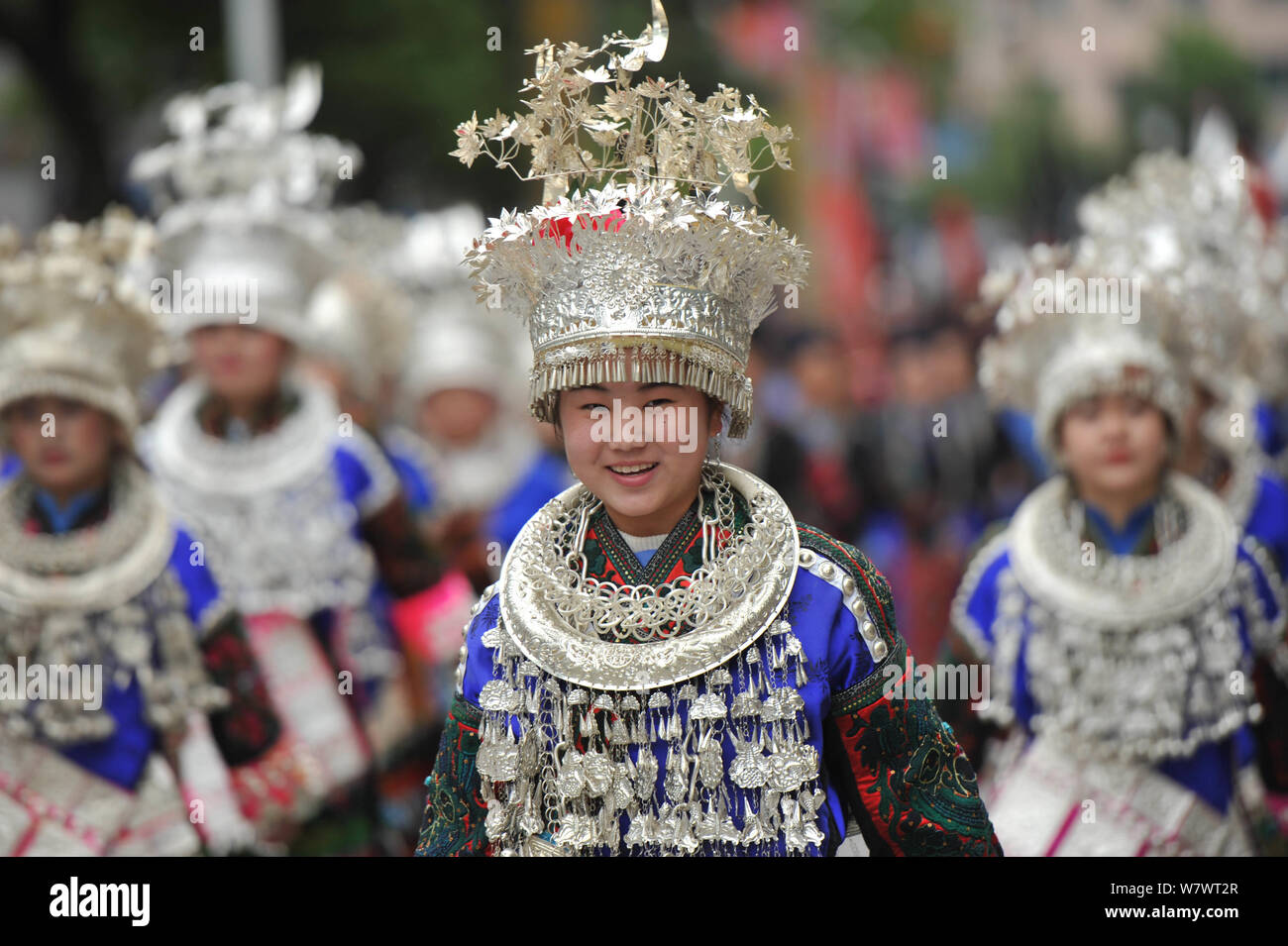 Chinese girls of Miao ethnic minority dressed in traditional silver ...
