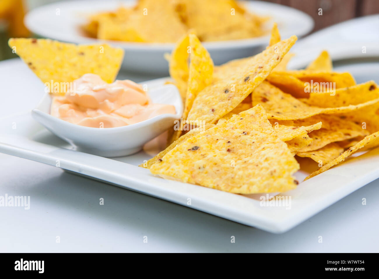 delicious plate of nacho with cream cheese Stock Photo - Alamy