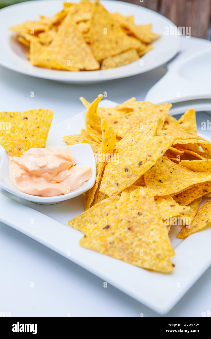 delicious plate of nacho with cream cheese Stock Photo - Alamy