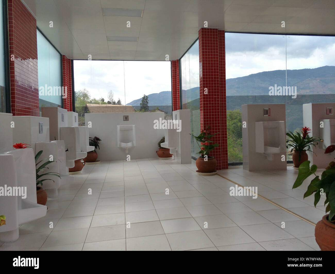 Interior view of a transparent toilet with glass walls to enable ...