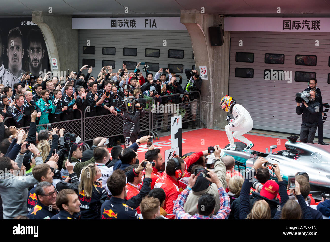 British F1 driver Lewis Hamilton of Mercedes celebrates on his car ...