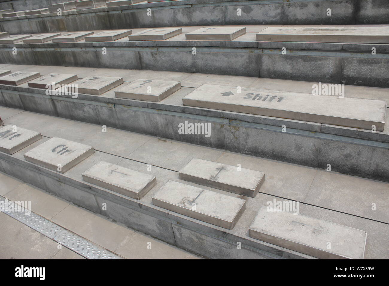 Painted stone slabs on stairs featuring a shape of a computer keyboard ...