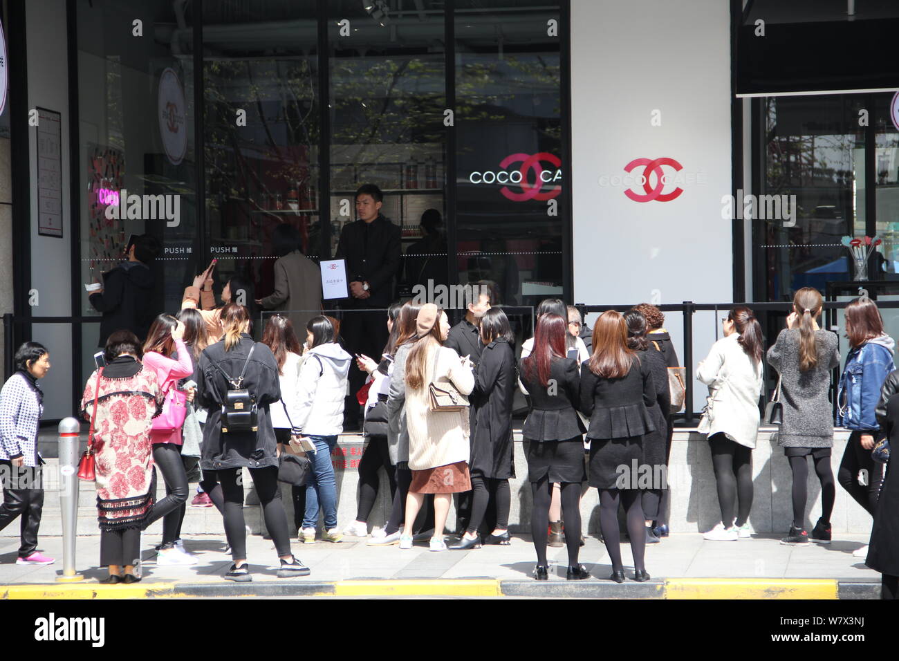 Chinese customers queue up in front of the Coco Chanel Cafe on West ...