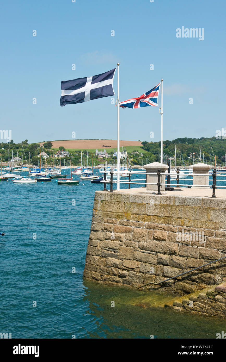 Cornish Saint Pirans and British Union Jack flags on pier at Falmouth ...
