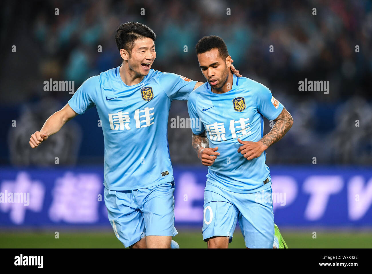 Brazilian football player Alex Teixeira of Jiangsu Suning, right ...