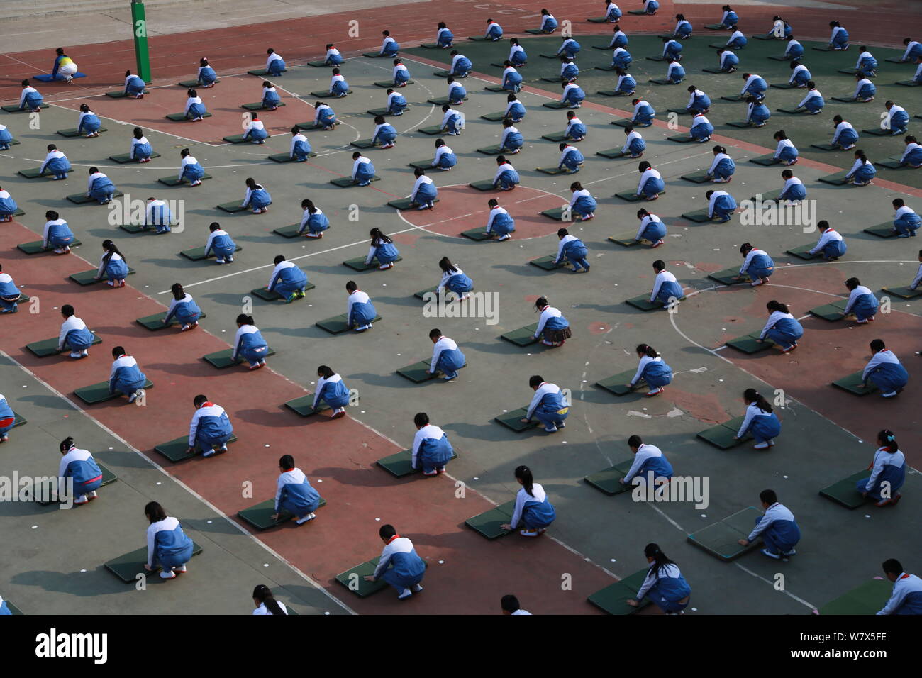 Chinese students practice gymnastics and yoga during class break on the ...