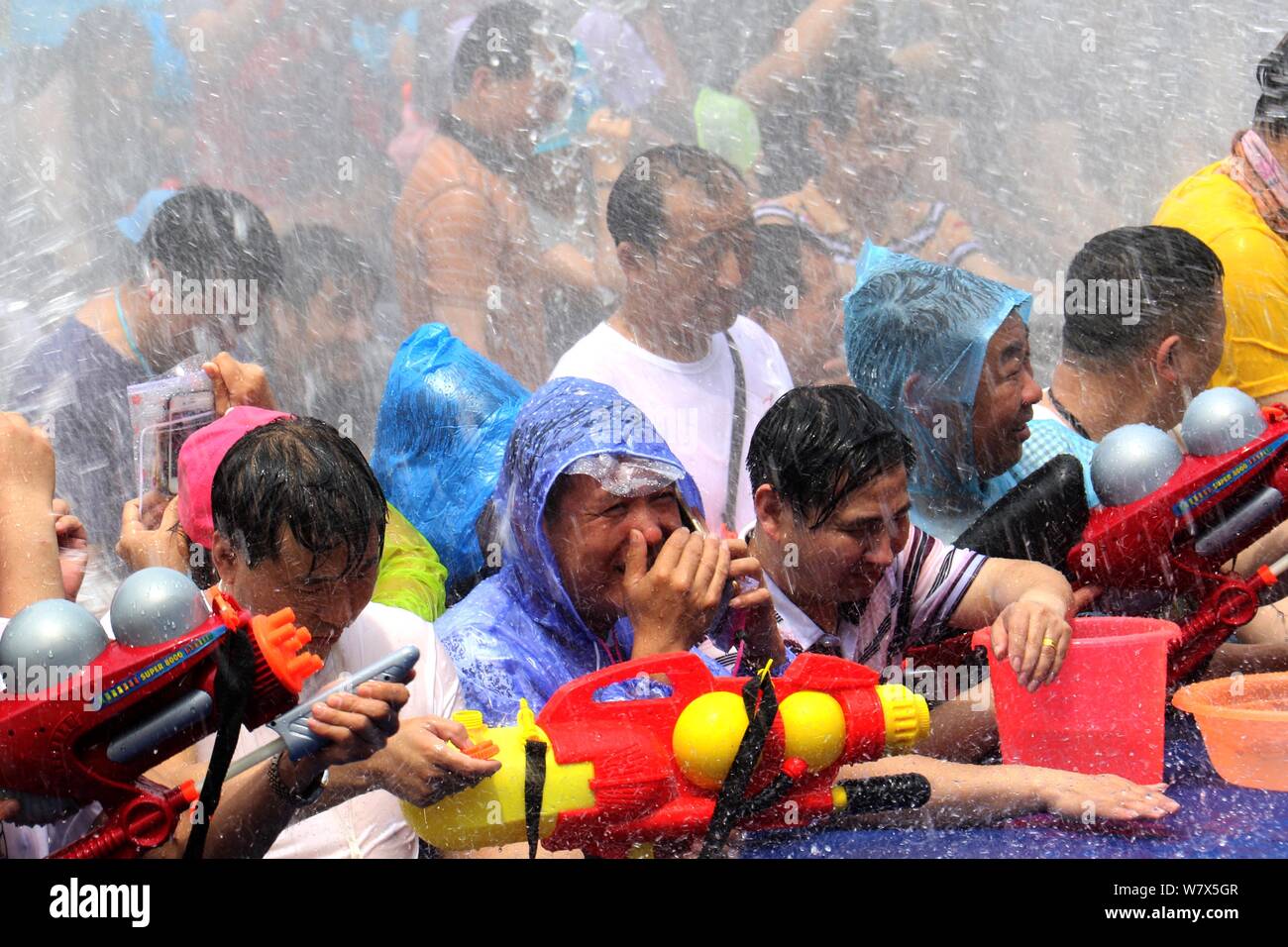 Local people and tourists sprinkle water to celebrate the Water ...