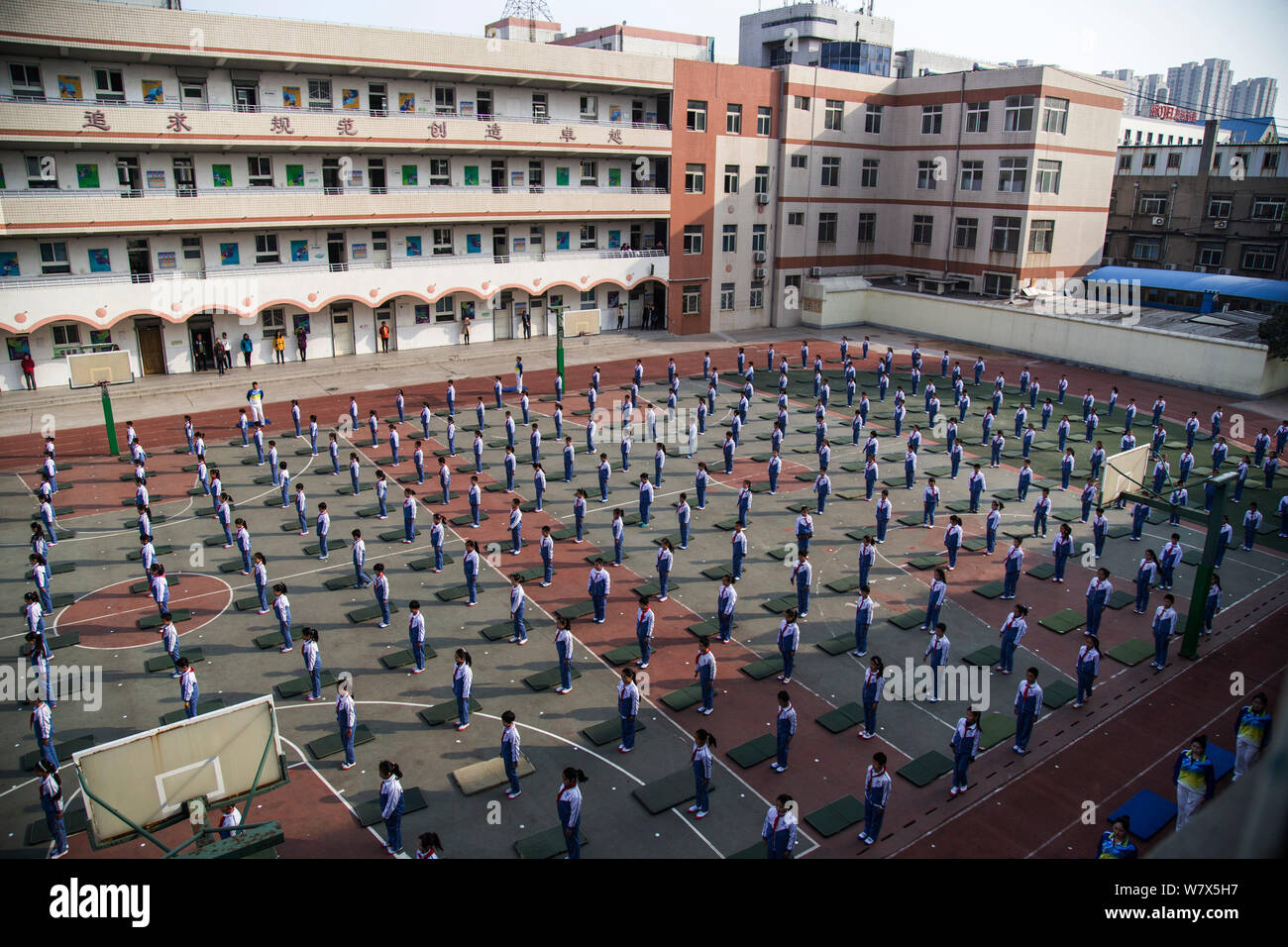 Chinese students prepare to practice gymnastics and yoga during class ...