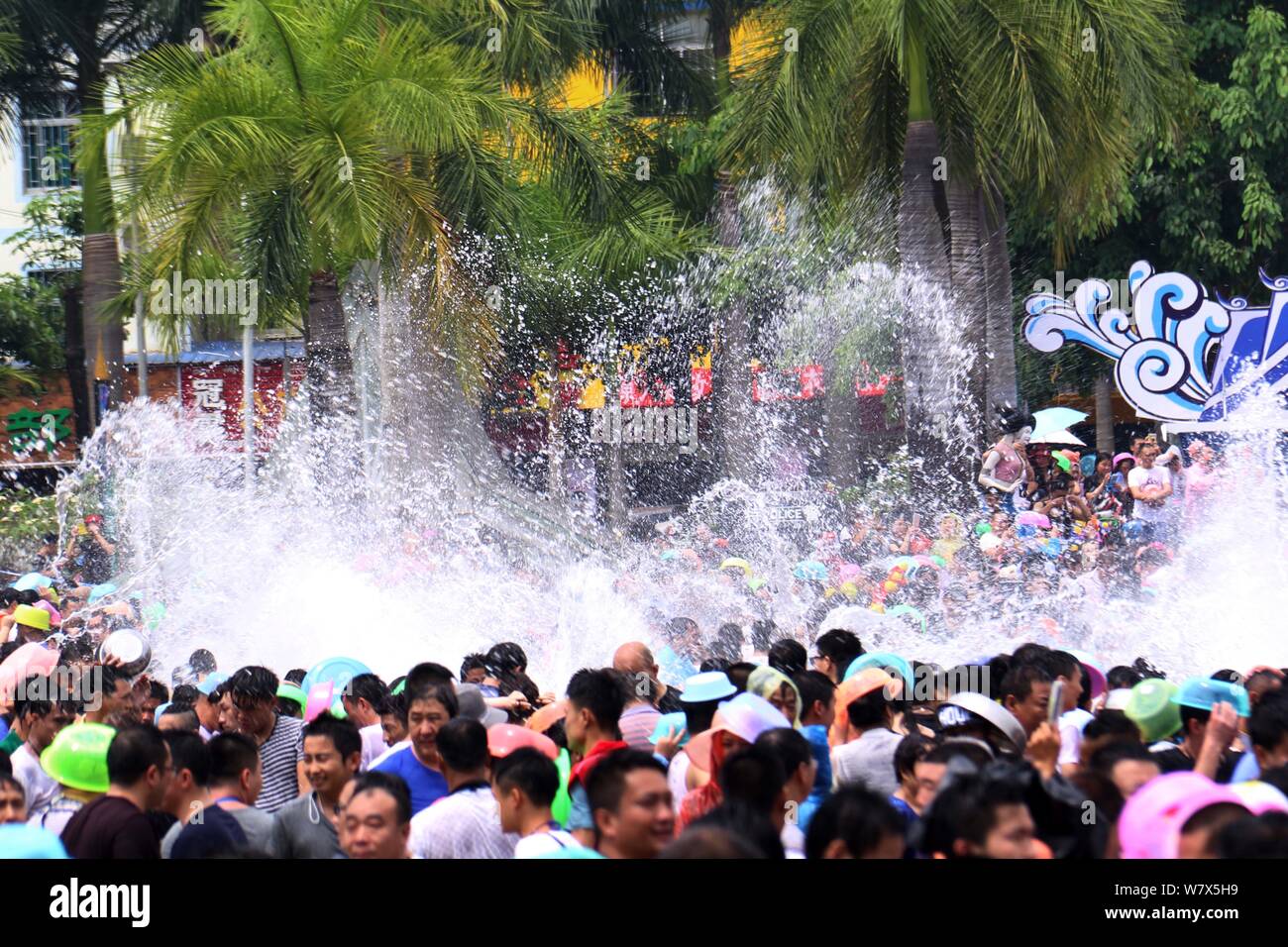 Local people and tourists sprinkle water to celebrate the Water ...