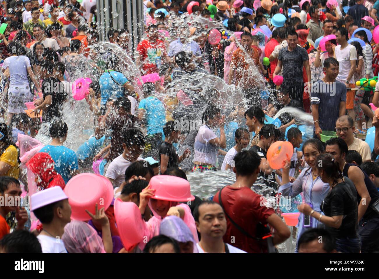 Local people and tourists sprinkle water to celebrate the Water ...