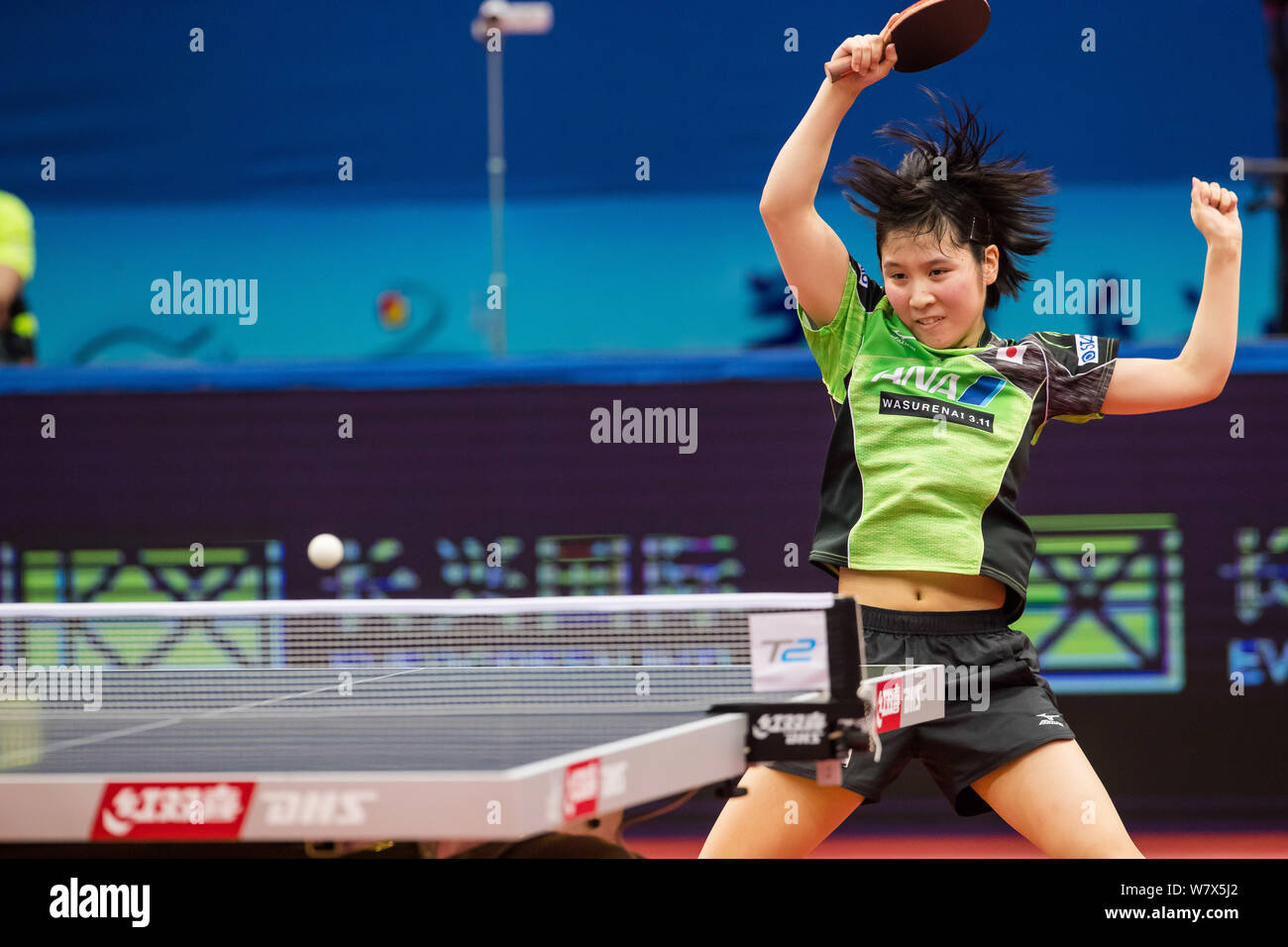 Miu Hirano of Japan returns a shot to Chen Meng of China in their women ...