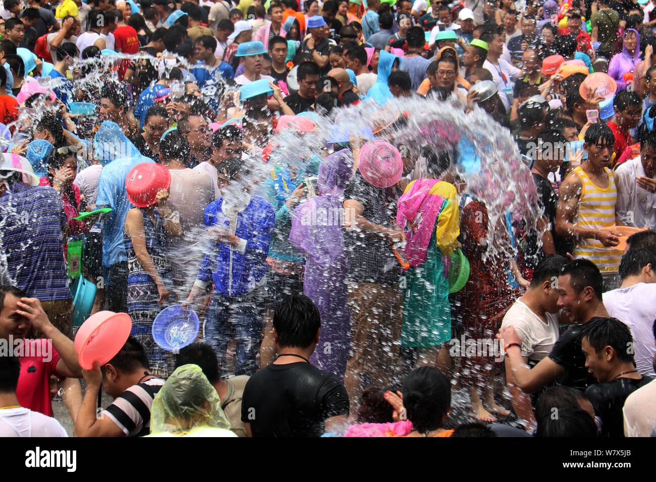 Local people and tourists sprinkle water to celebrate the Water ...