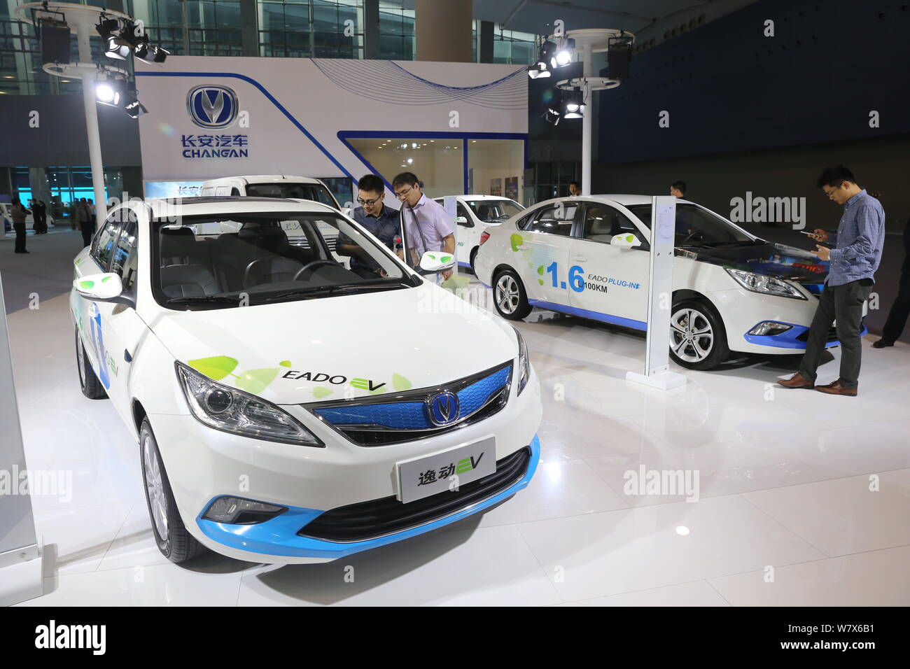 --FILE--People look at a Changan Eado EV during the 13th China ...