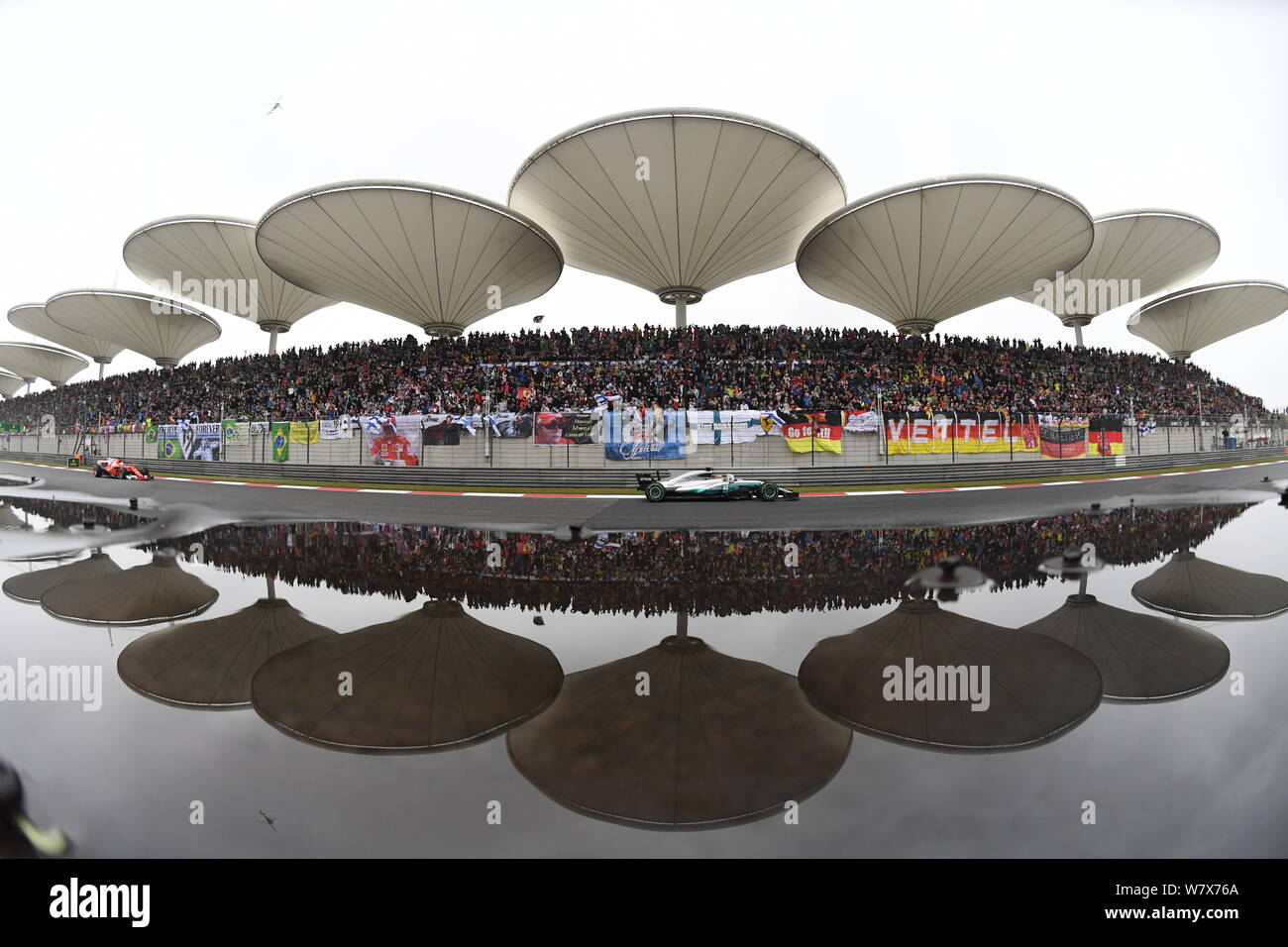 F1 racers compete during the 2017 Formula One Chinese Grand Prix at the ...