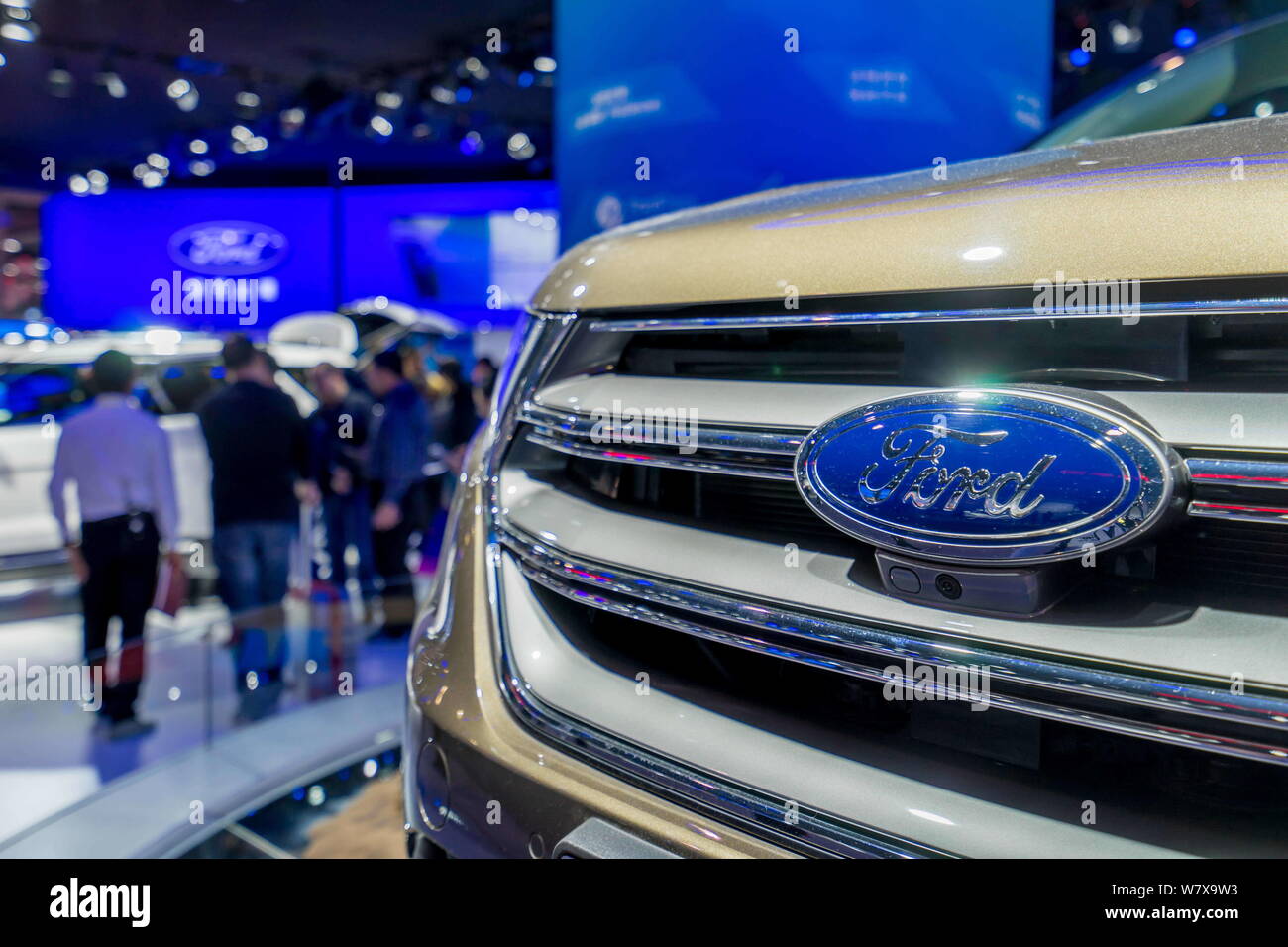--FILE--Visitors walk past a Ford car on display during the 14th China ...