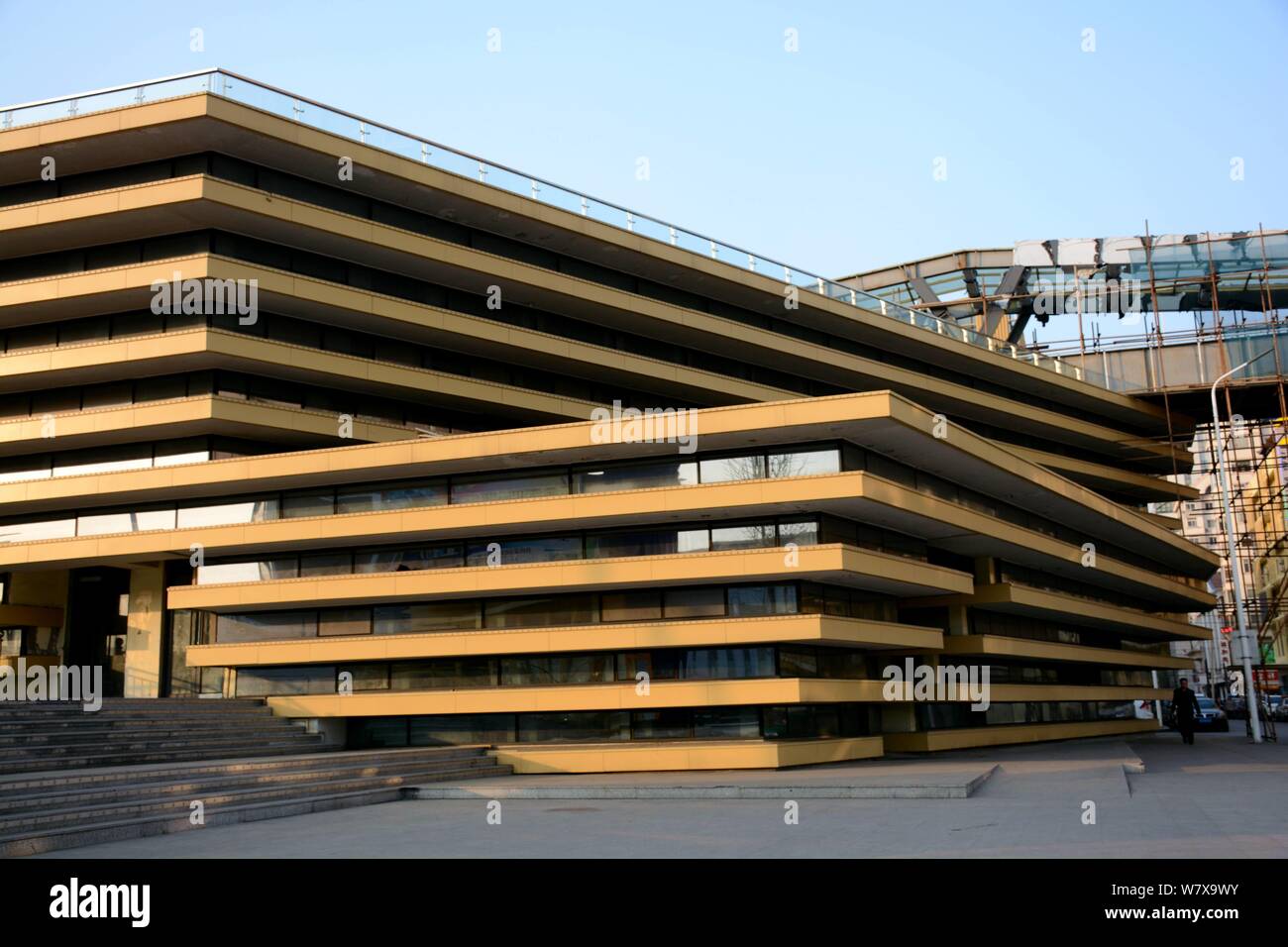 A shopping mall with extended layers of floor resembling Chinese snack ...