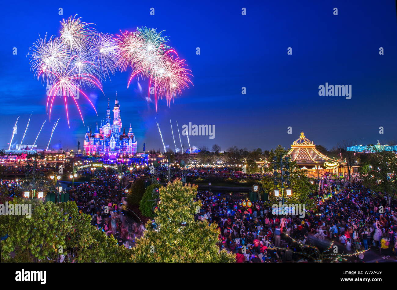 Fireworks explode over the Disney Castle in the Shanghai Disneyland at ...