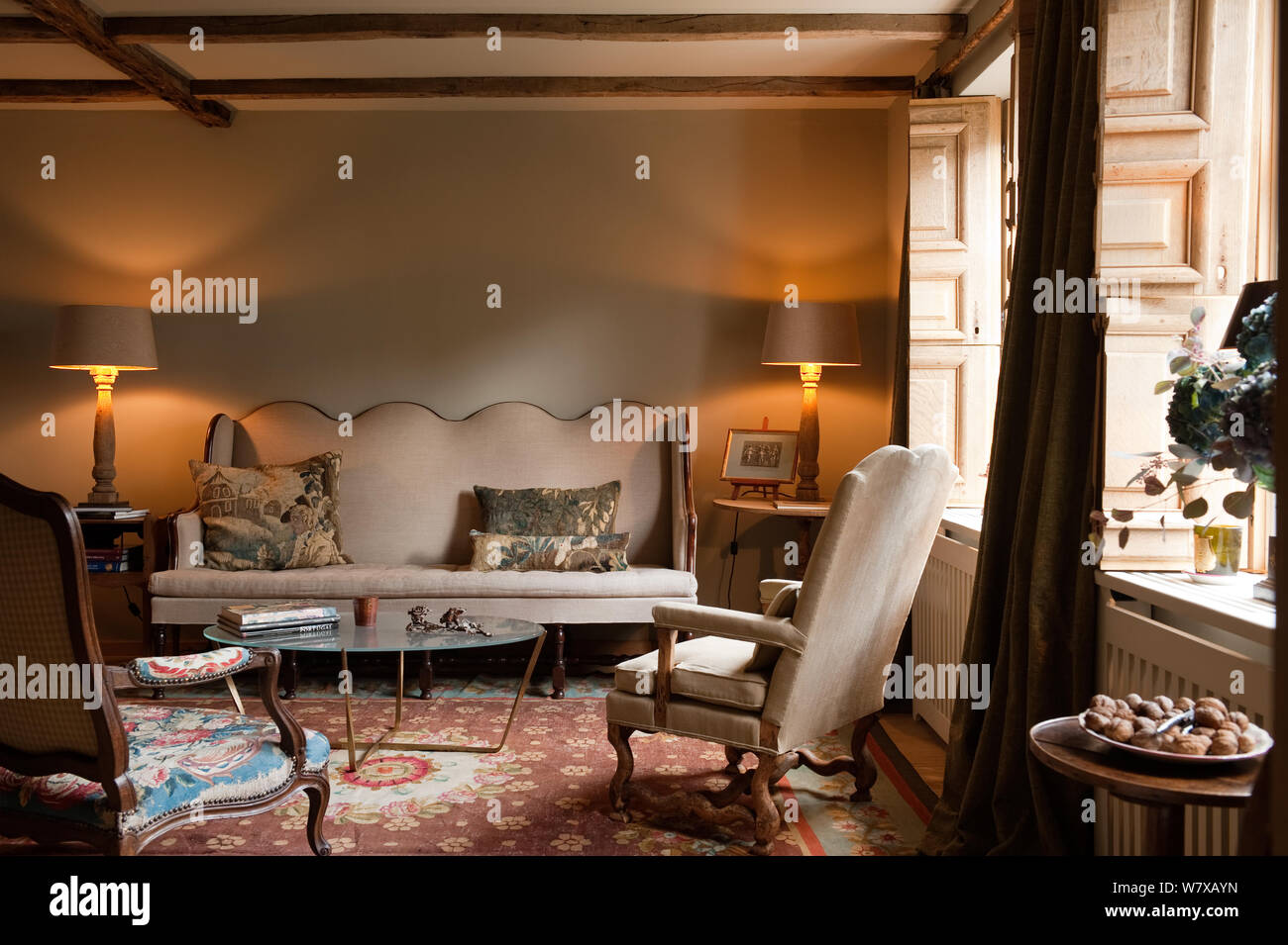 Sofa in country style living room Stock Photo - Alamy